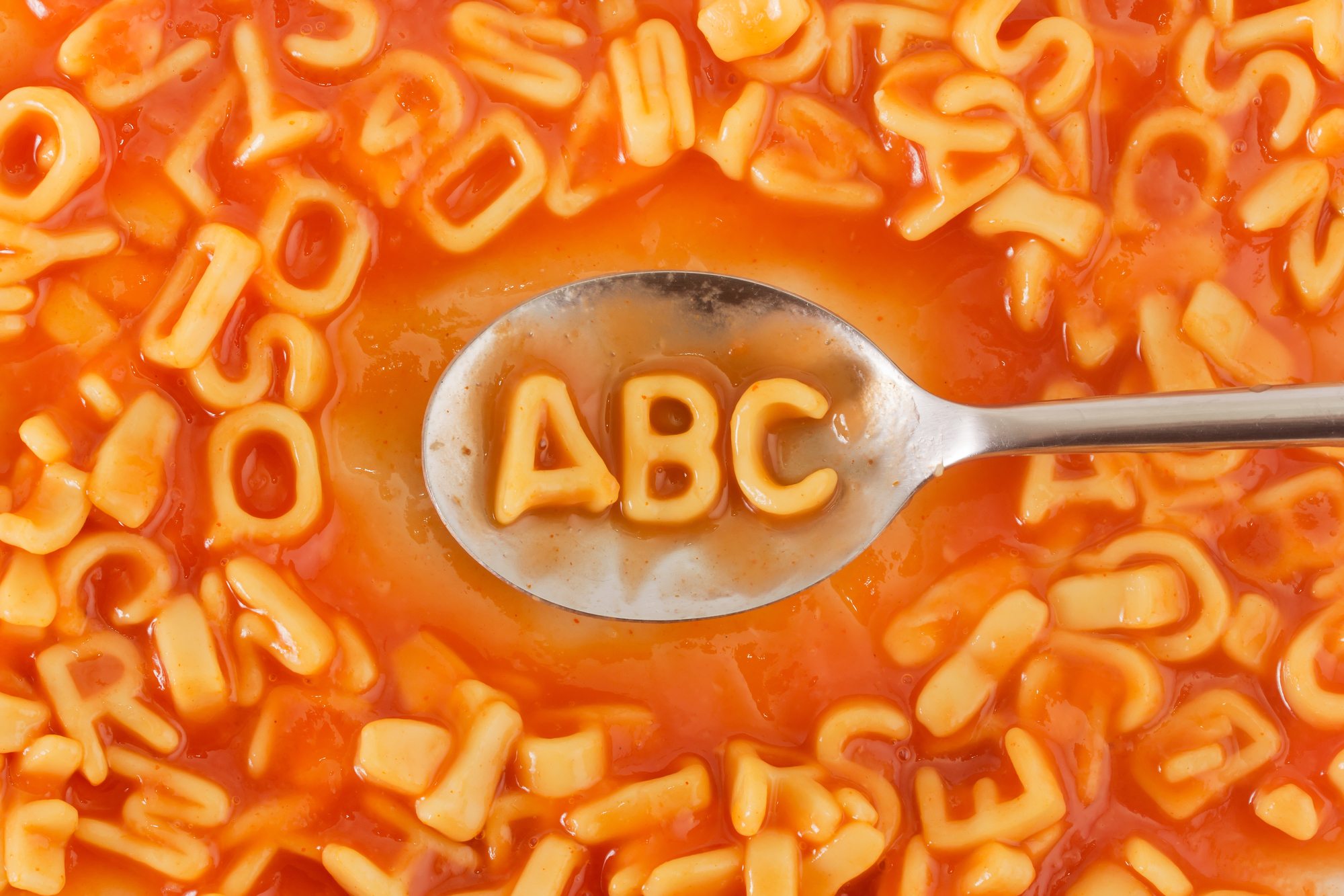 Pasta Shaped ABC Letters In Tomato Sauce On A Spoon Boom Pasta Shaped ABC Letters In Tomato Sauce On A Spoon Boom